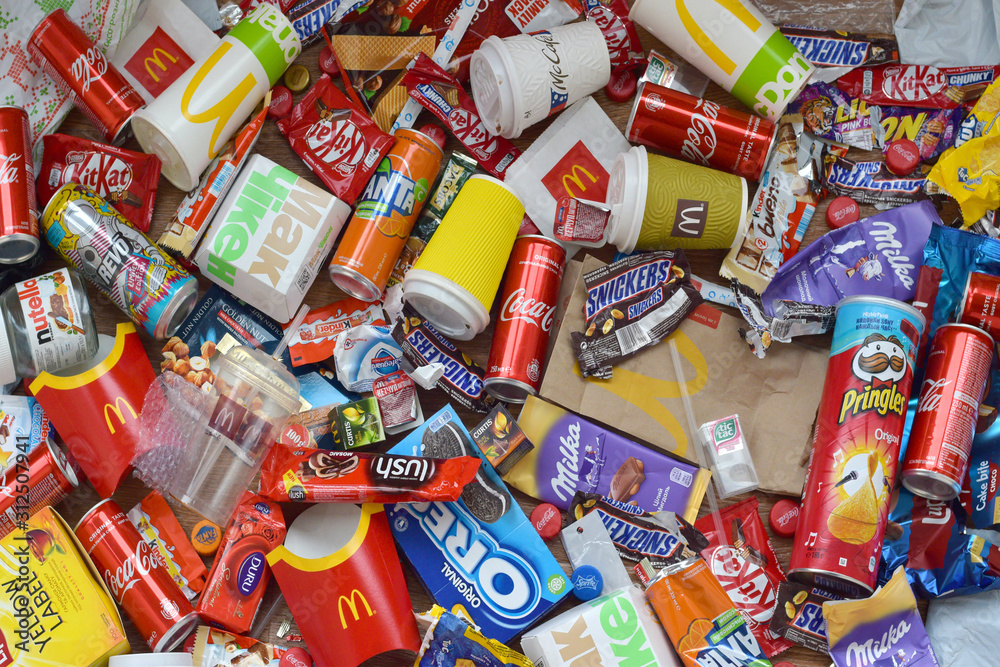 Big pile of many disposable colored trash from edible products of ...