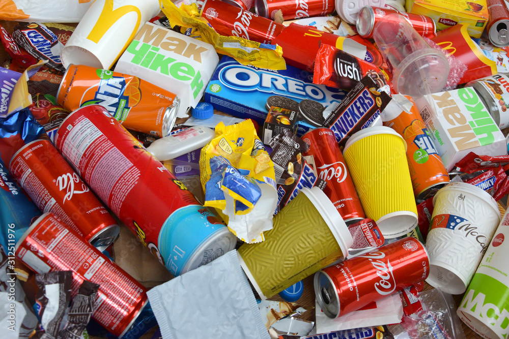 Big pile of many disposable colored trash from edible products of ...