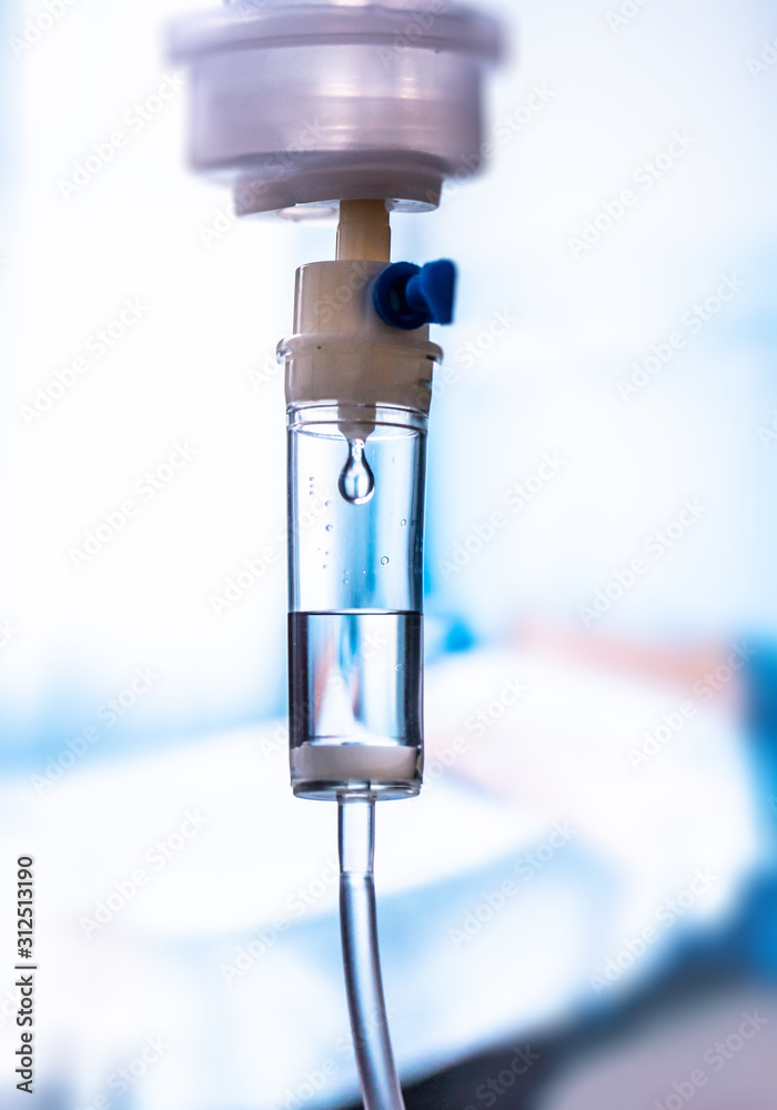 Dripping medical perfusion close up equipment in clinic background ...