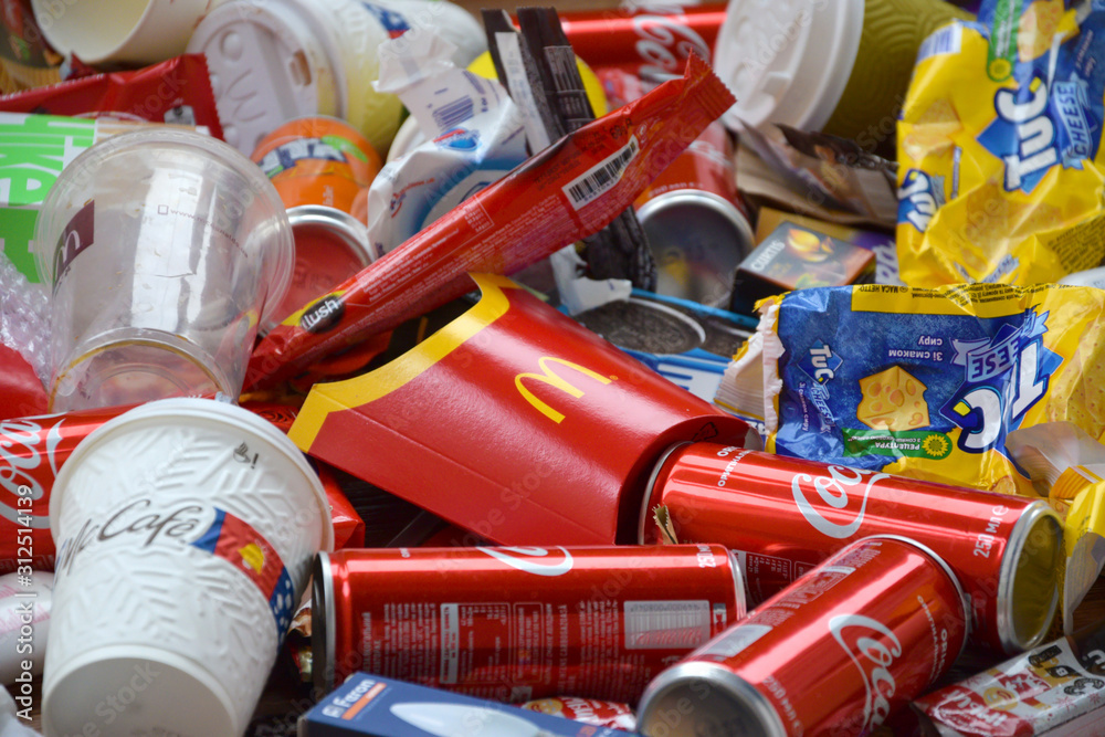 Big pile of many disposable colored trash from edible products of ...