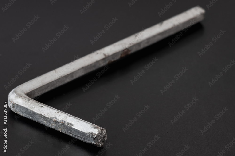 hexagon socket screw l shaped allen key in a black background isolated ...