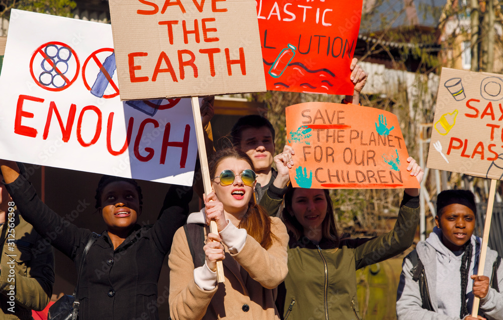 People protesting on street with posters Stock Photo | Adobe Stock