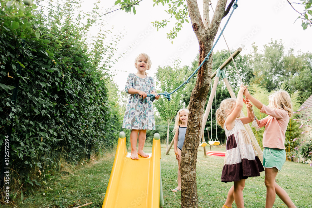 stock photo of little girls playing in the backyard Stock Photo | Adobe ...