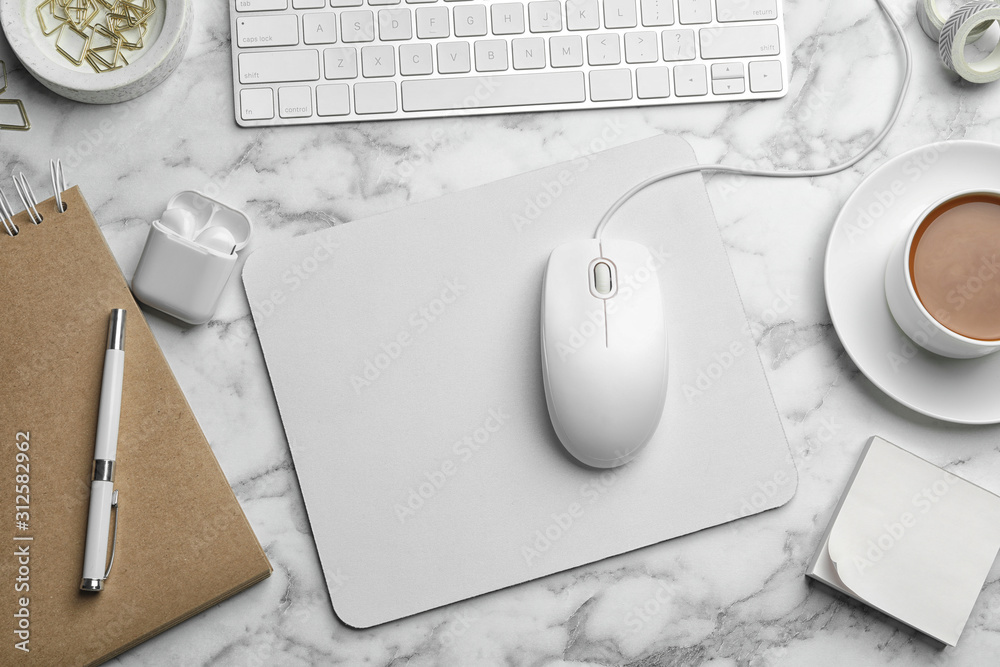 Modern workplace with mouse and keyboard on marble table, flat lay ...