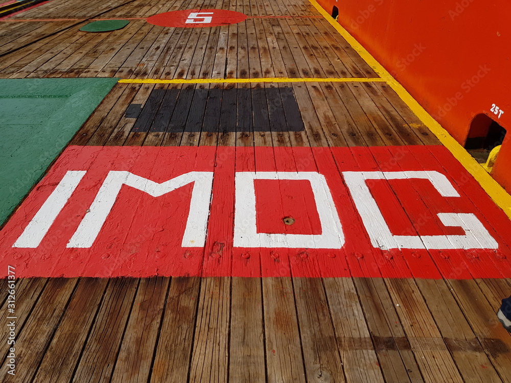 IMDG or International Maritime Dangerous Goods Code painted with red ...