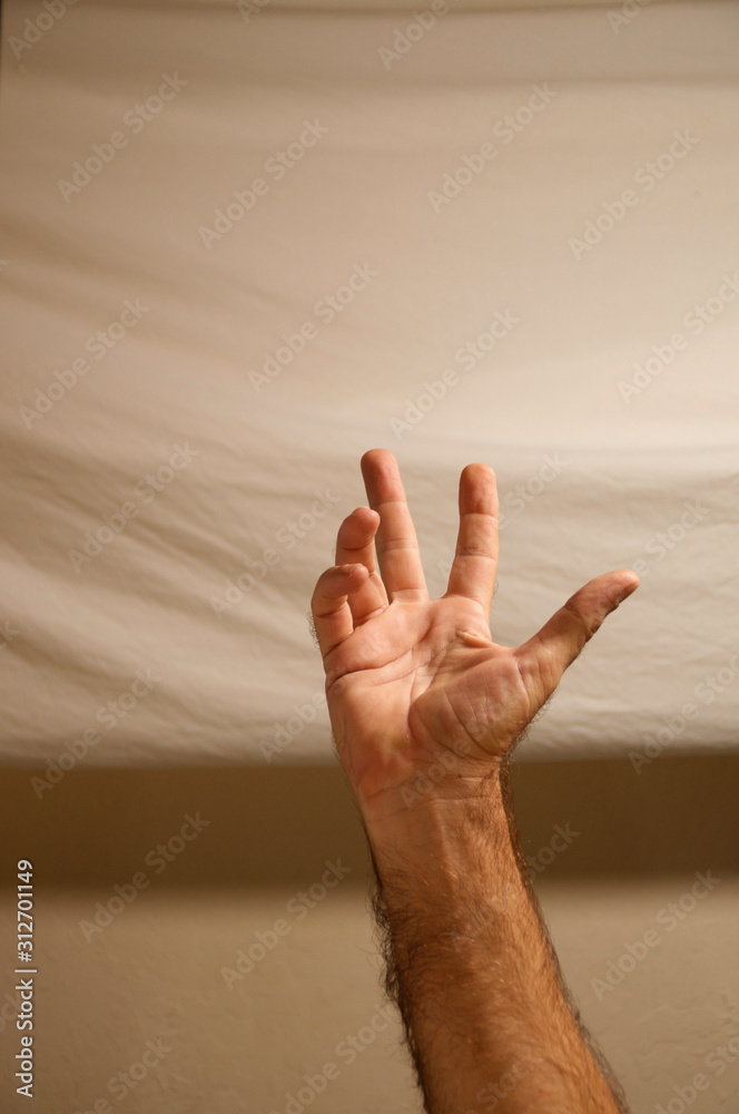Image of hairy man's arm reaching up with right hand palm open. Stock ...