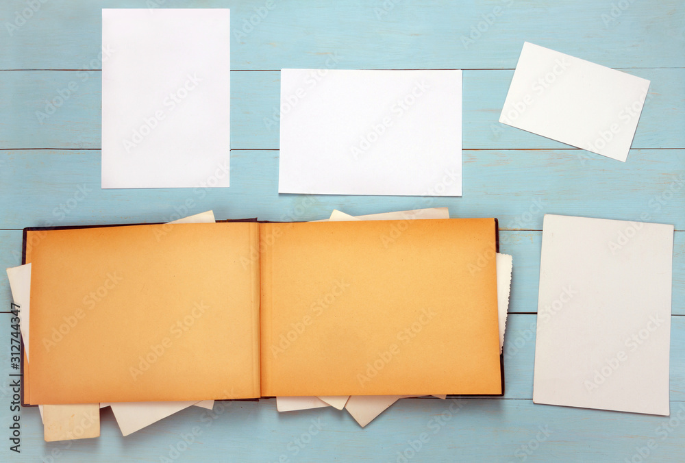 Old photo album with photos on a beautiful wooden table.Mockup free ...
