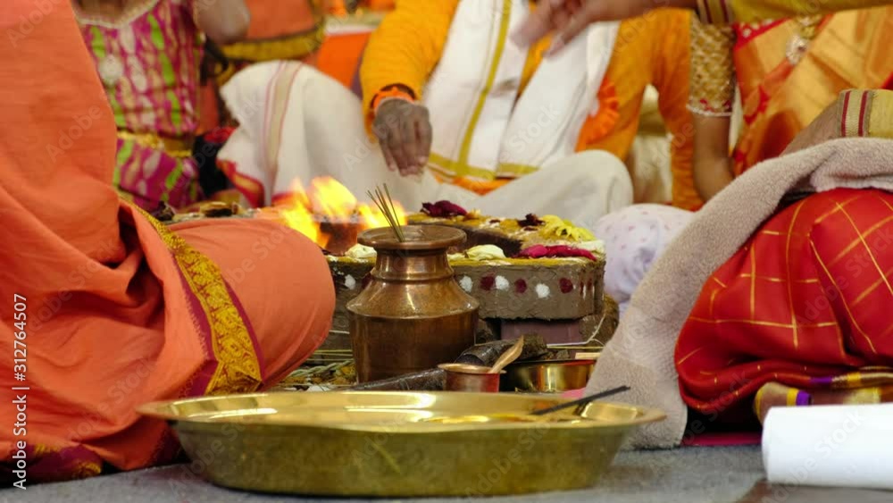Homa or havan fire ceremony performed at hindu temple. Incense and ghee ...