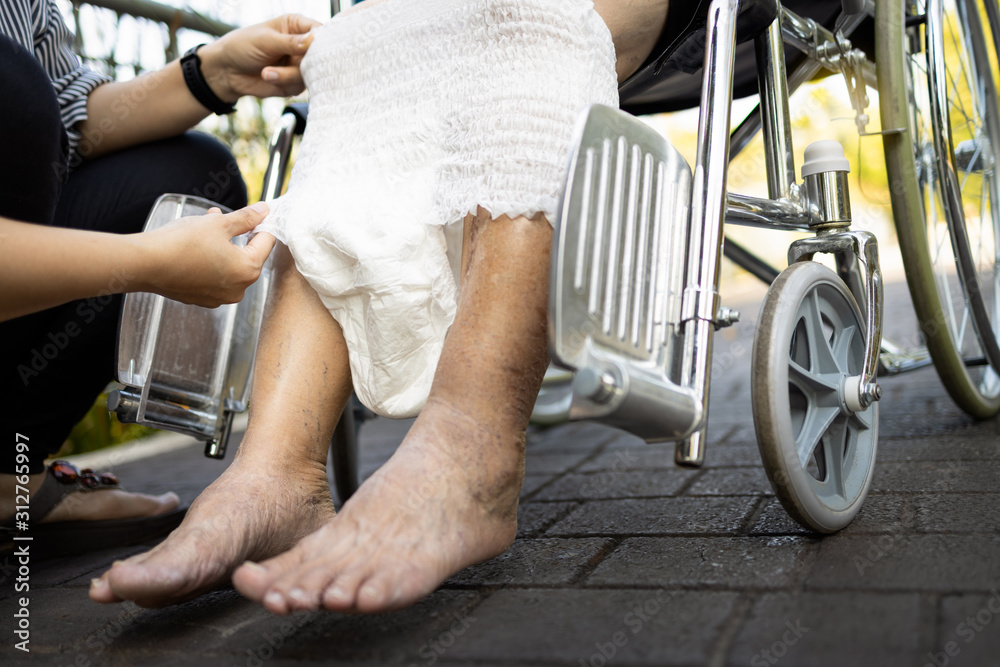 Hand of woman giving adult diaper change at nursing home,asian senior ...