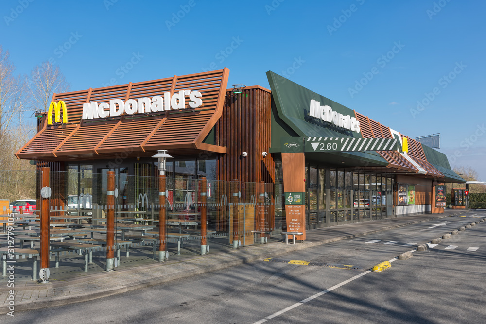 Exterior of modern Mc Donald's fastfood restaurant with drive-thru ...