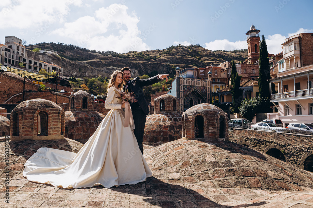 Stylish couple of brides: Georgian-style wedding, man with mustache ...