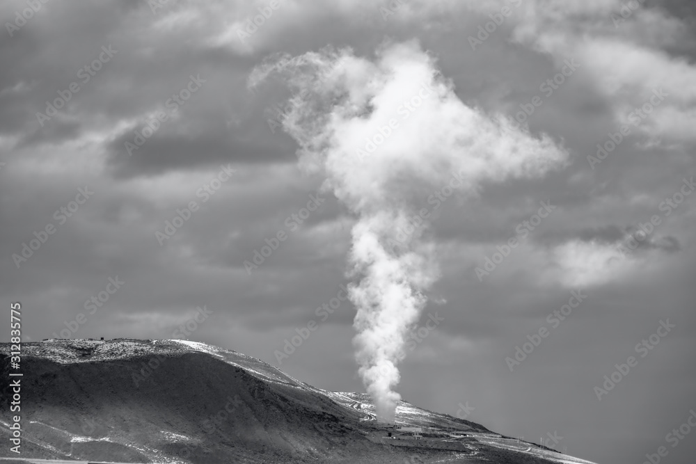 Steam rising from a geothermal power plant. Stock Photo | Adobe Stock