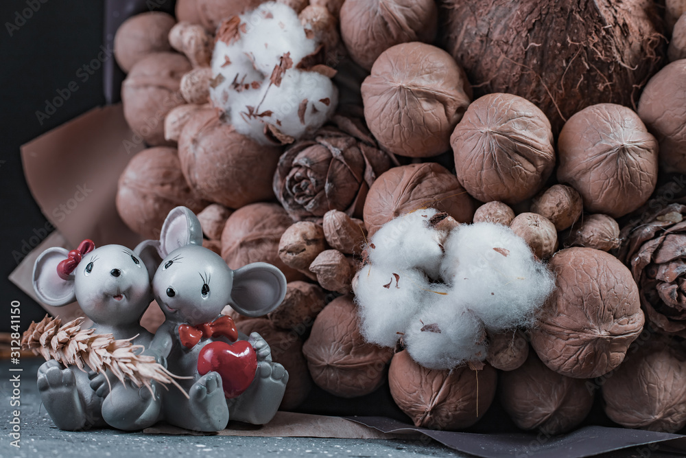 Statuette of two mice in love with Bouquet of various nuts with ...