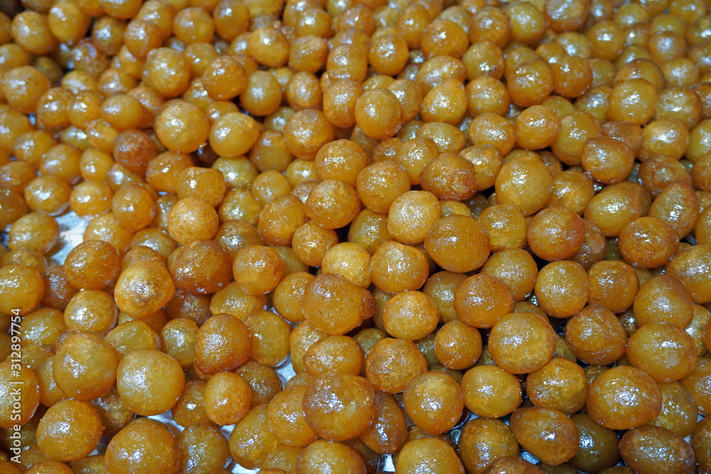 Variety of sweets on the arab street market stall. Eastern sweets in a ...