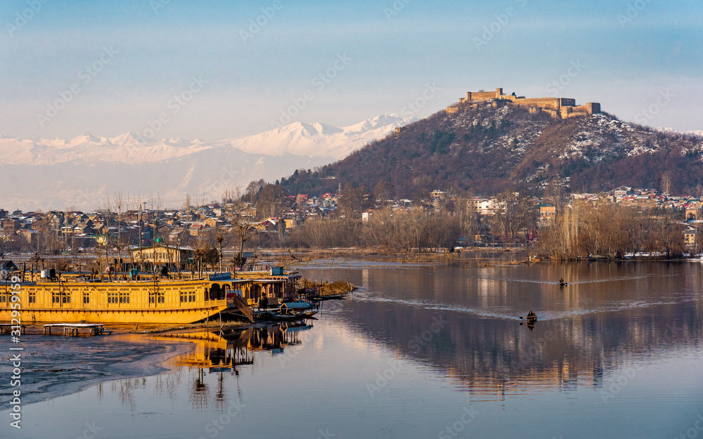View of Dal lake and the Fort after sunrise in Srinagar during winter ...