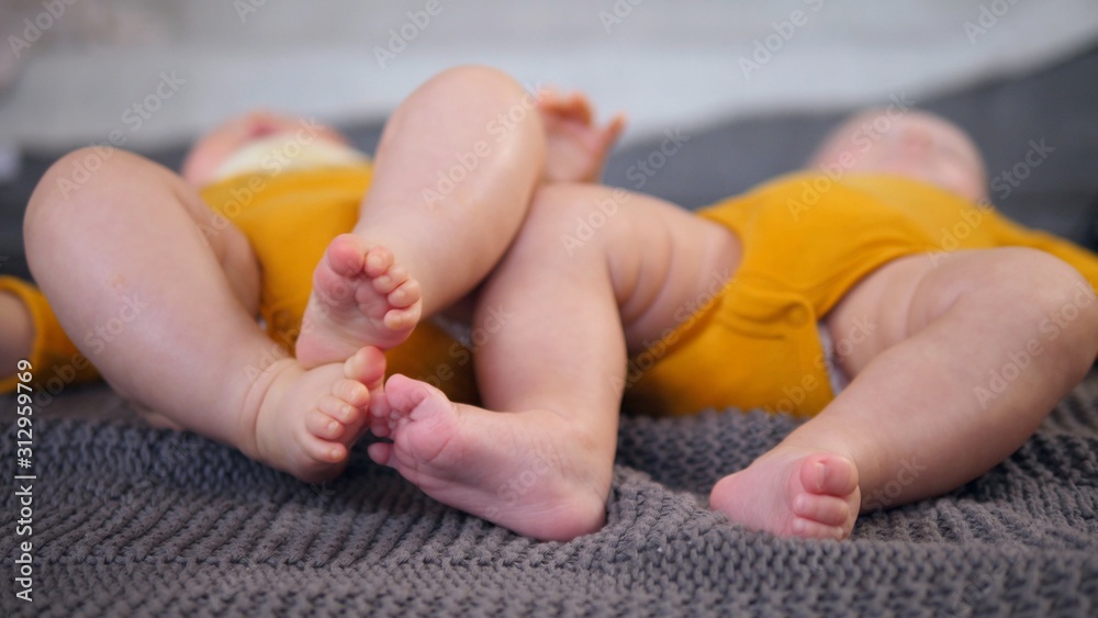 Twin Baby Feet. Closeup. Tiny Newborn Baby's Feet. Twins Feet. Stock ...