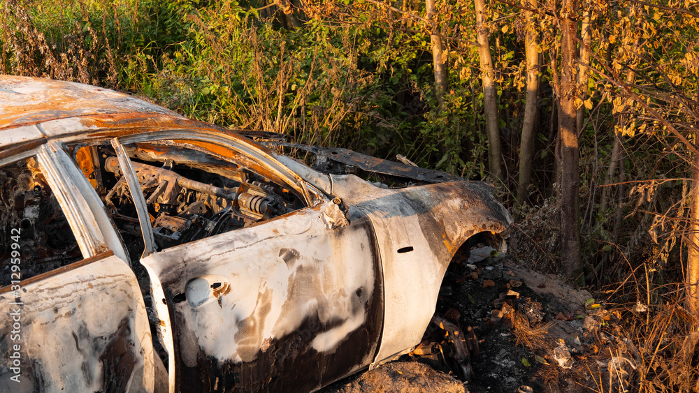 Burnt out car, closeup. Inside a burnt auto.Melted glass due to high ...