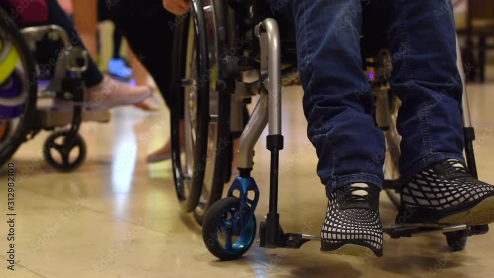 Wheelchair event. Handicapped people have fun at a party. Special needs ...