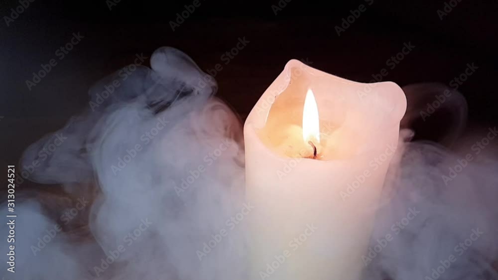 haunted theme and scary white smoke fog rolling over an old oak table ...