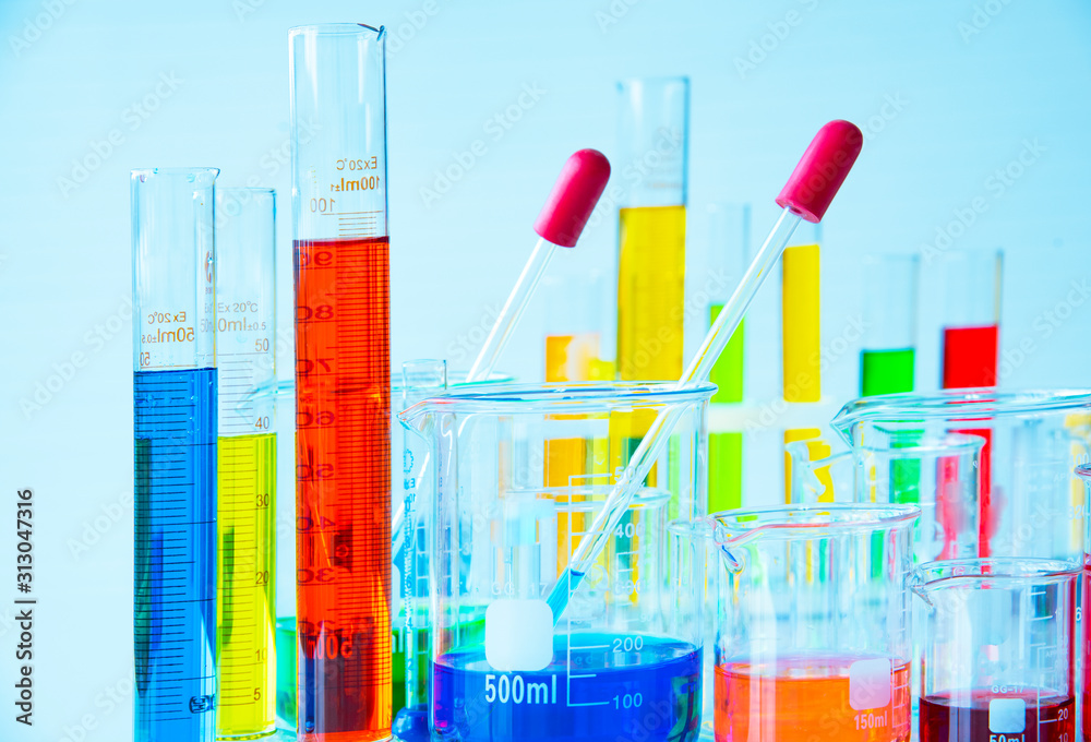 Several test tubes and solution beakers in a science laboratory with ...