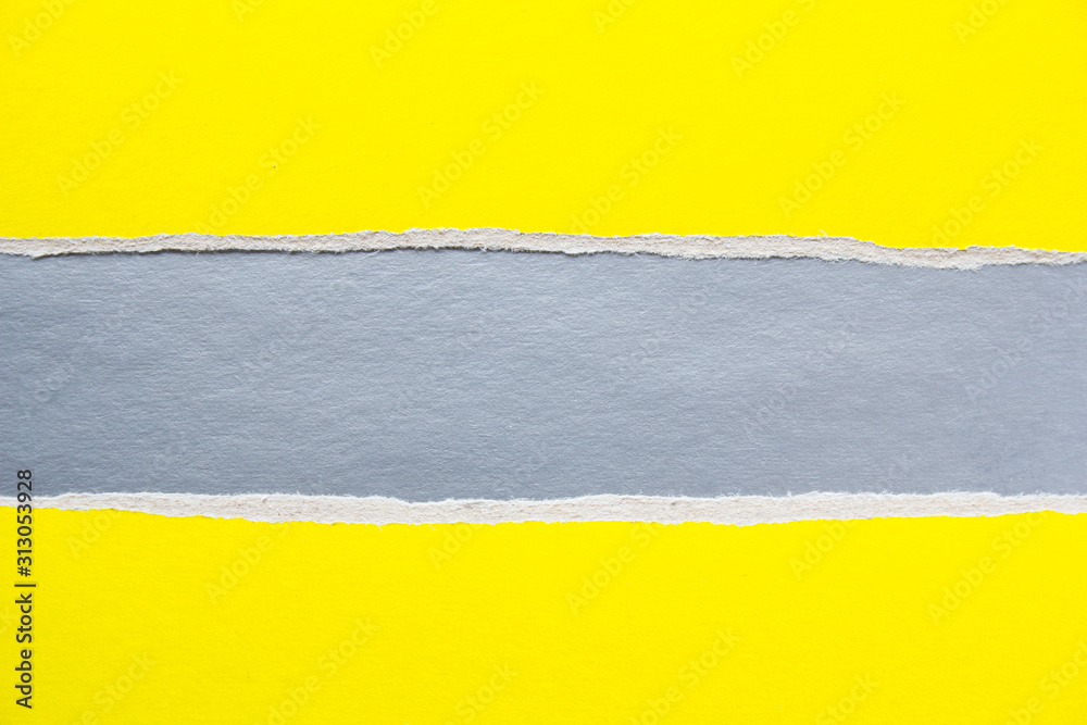 Silver grey and yellow torn and ripped sheet of cardboard paper texture ...