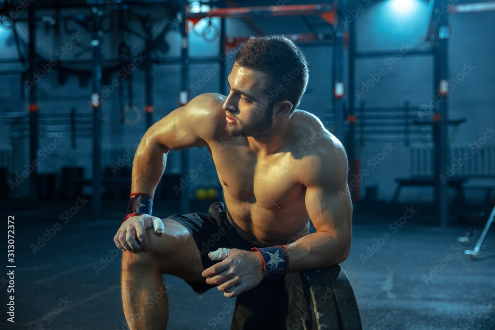 Caucasian man practicing in weightlifting in gym. Caucasian male ...