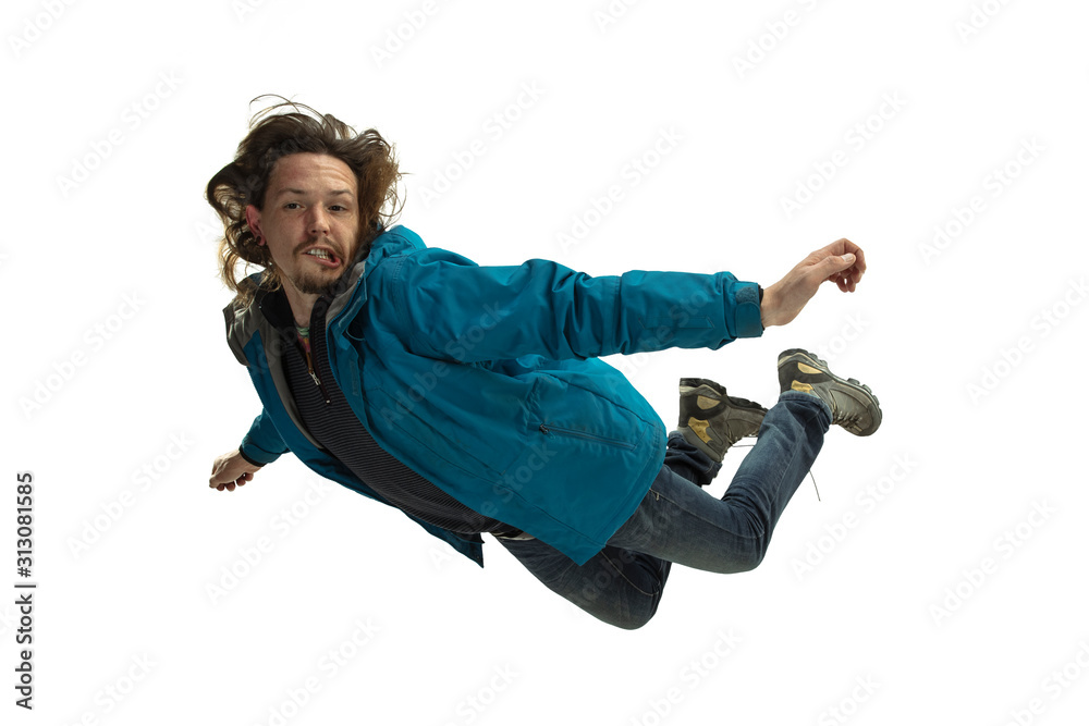 A second before falling. Caucasian young man falling down in moment ...