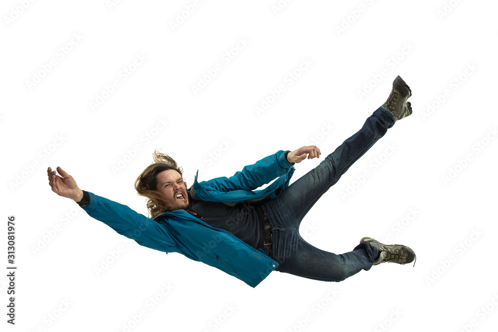 A second before falling. Caucasian young man falling down in moment ...