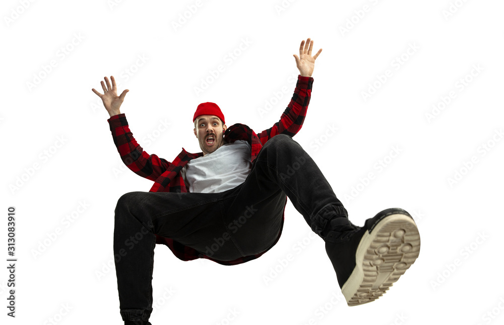 A second before falling. Caucasian young man falling down in moment ...