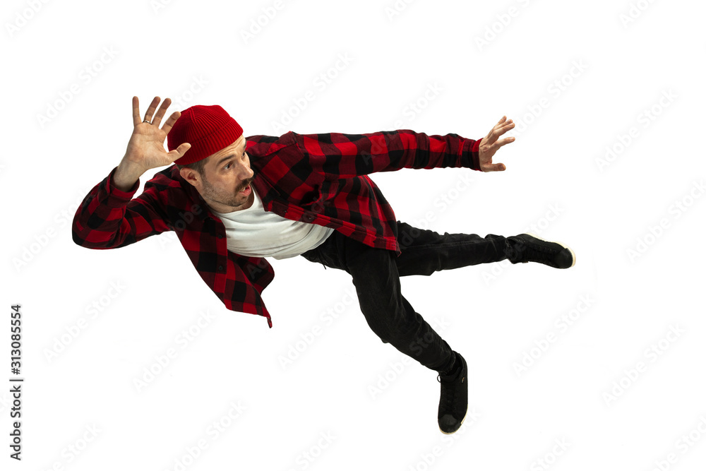 A second before falling. Caucasian young man falling down in moment ...