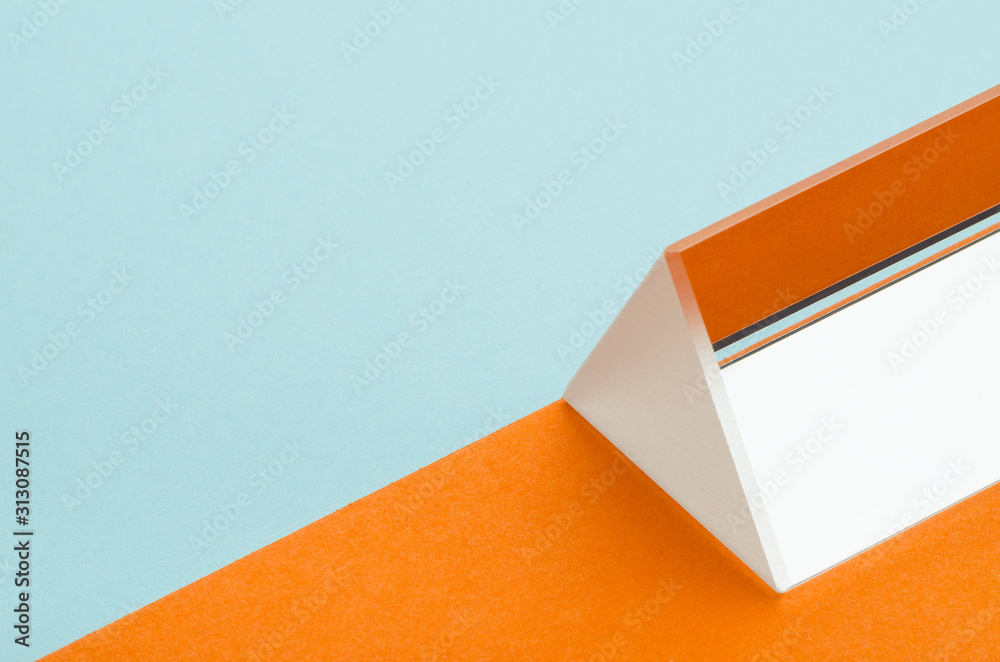 triangular prism on orange-blue background, minimalism, abstraction ...