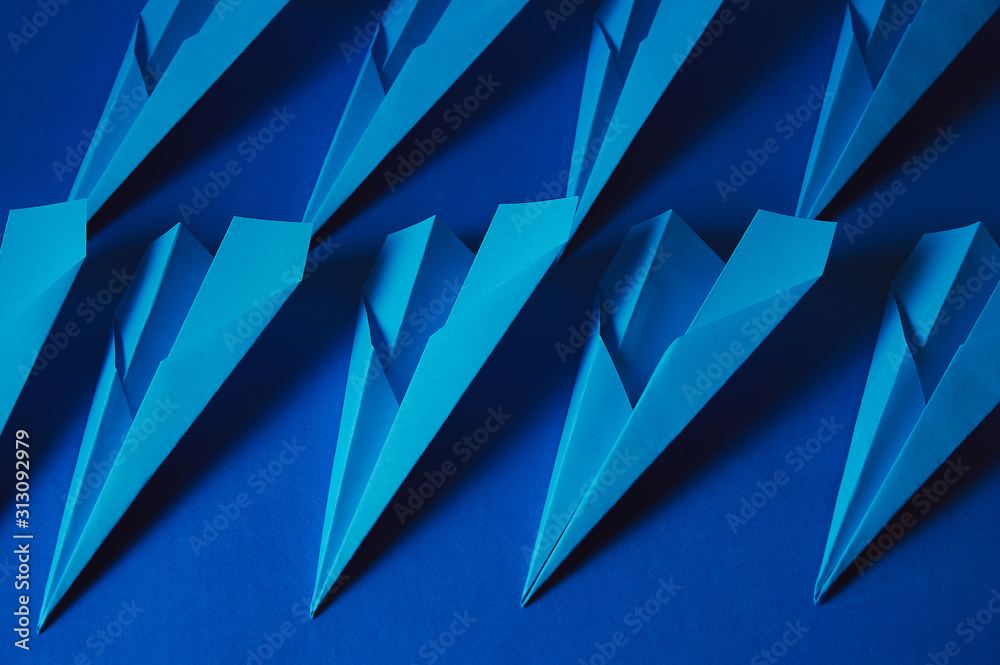 A lot of blue paper planes on a classic blue background. Stock Photo ...