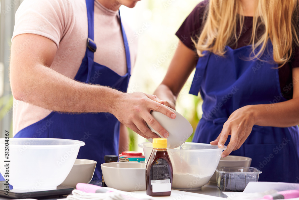 Students Measuring And Cooking