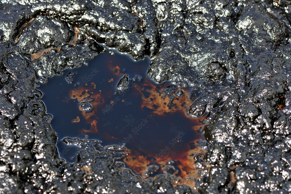 Spills of crude oil on the soil surface Stock Photo | Adobe Stock
