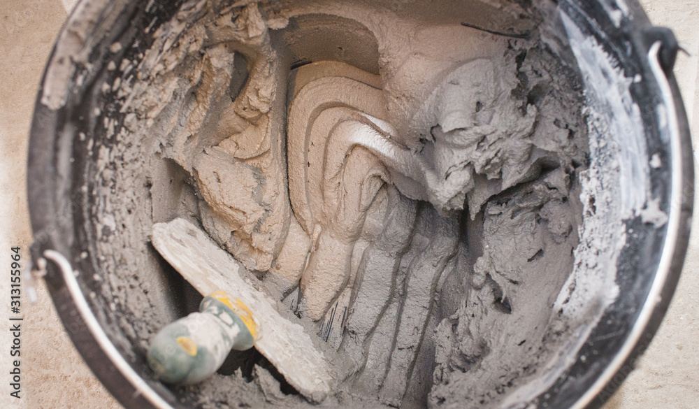 Tools for builder - bucket with a stucco and trowel Stock Photo | Adobe ...
