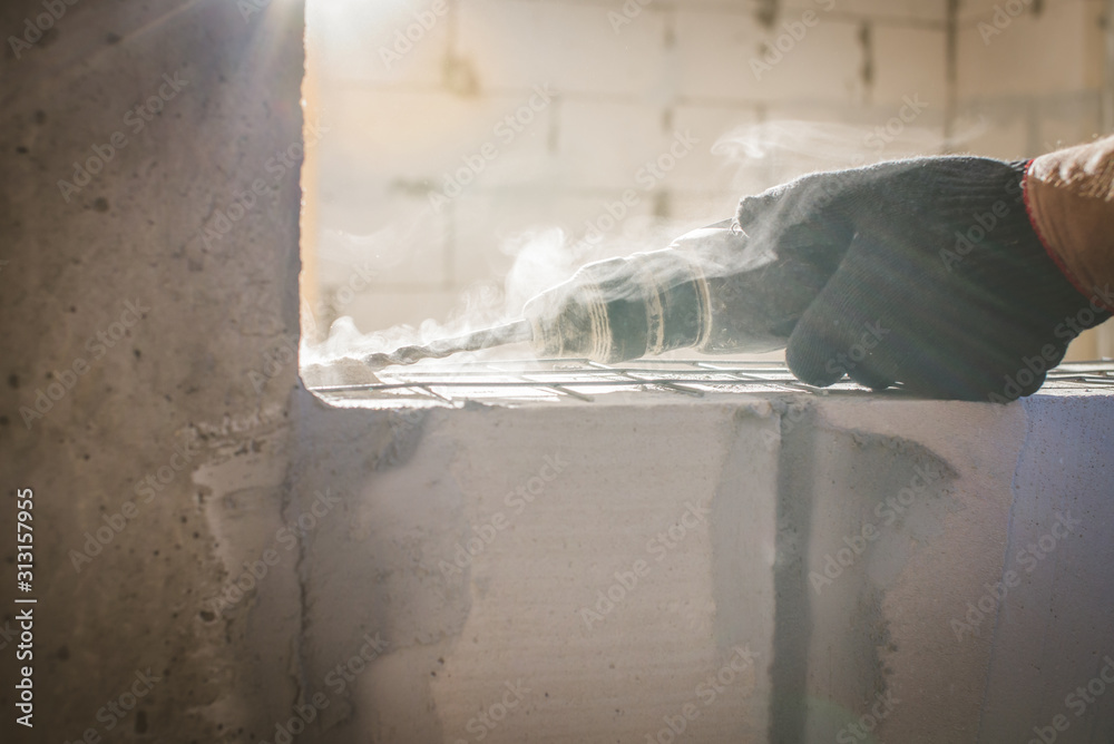 Manpower chipping column concrete for setting elevation concrete ...