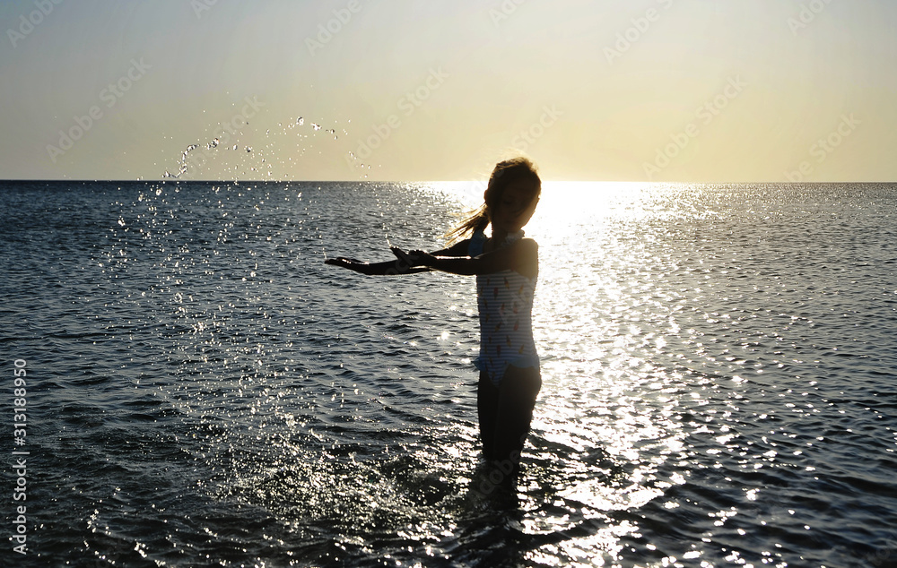 Cute little girl has fun on the beach. Summertime concept. Stock Photo ...