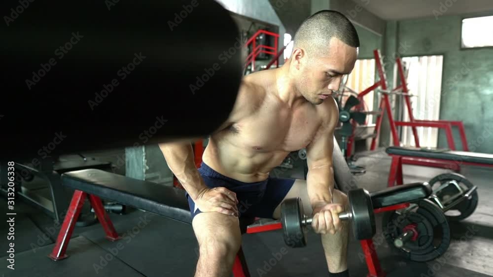 Male bodybuilder lift up dumbbell in the gym, Asian man are Create ...