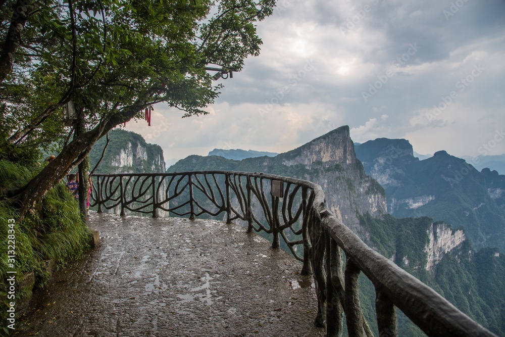 Tianmen Mountain Known as The Heaven`s Gate surrounded by the green ...