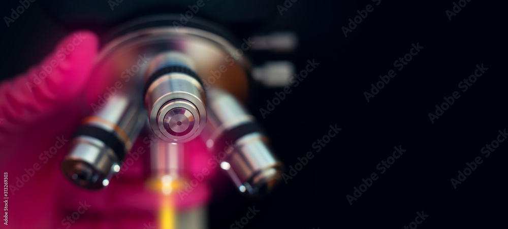 Optical microscope with a human hand. Science study and microscopic ...
