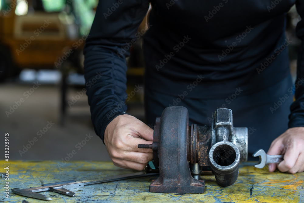 Mechanic man inspection turbocharger on working table Stock Photo ...