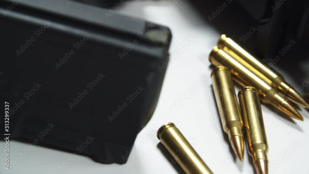 Vidéo Stock Close up of automatic gun black barrel and few bullet ...