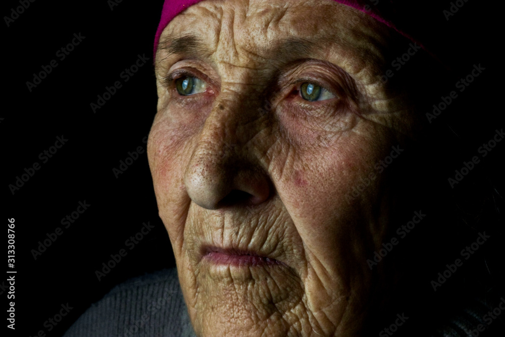 Tear on grandma's old wrinkled cheeks. Eyes of an old woman close-up ...