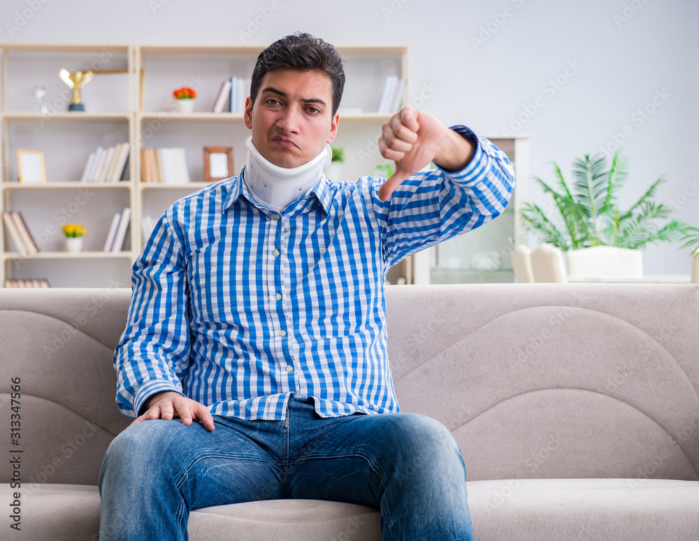Young man suffering a neck spine head trauma wearing a cervical Stock ...
