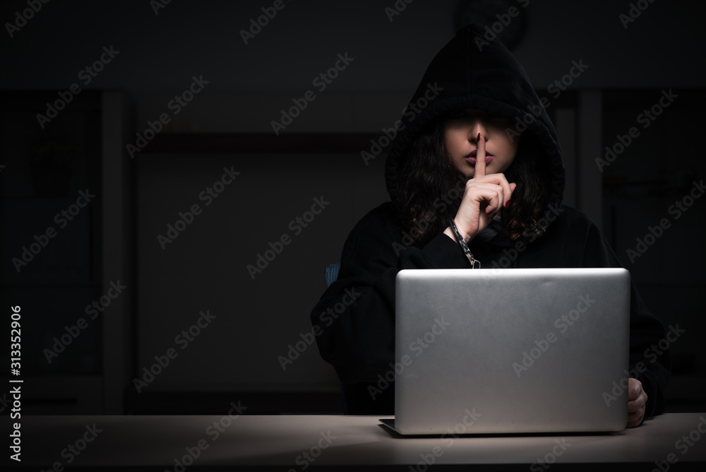 Female hacker hacking security firewall late in office Stock Photo ...
