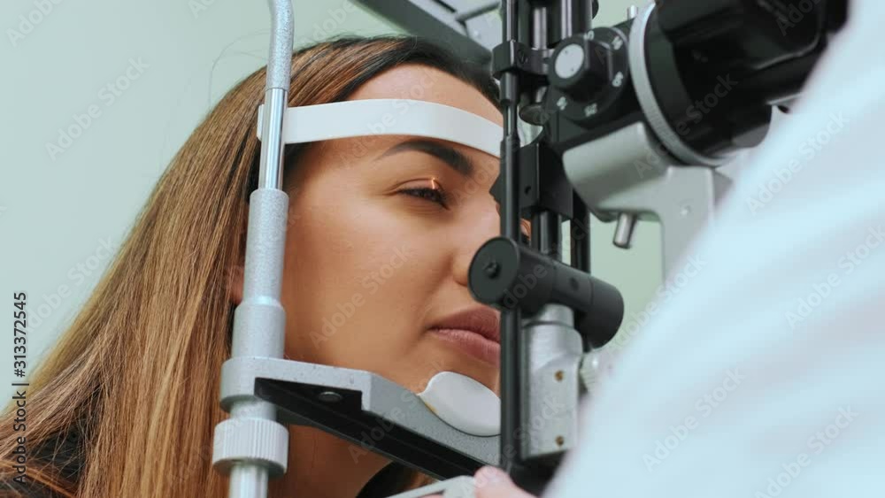 Eyes measured with refractometer at optician or ophthalmologist ...
