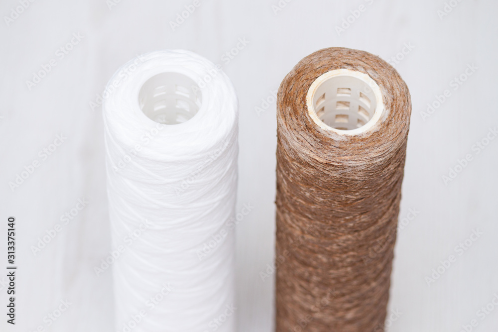 Dirty water filter cartridge used and clean new filter. Domestic water ...