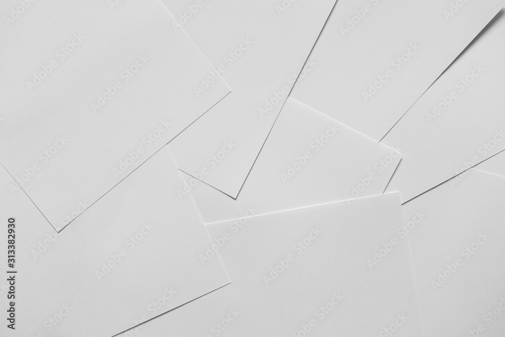 Heap of scattered white empty clean blank paper sheets. Top view ...