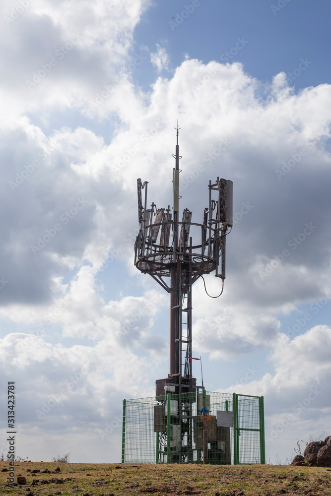 Broadcast relay station antennas at rising. Telecommunications towers ...