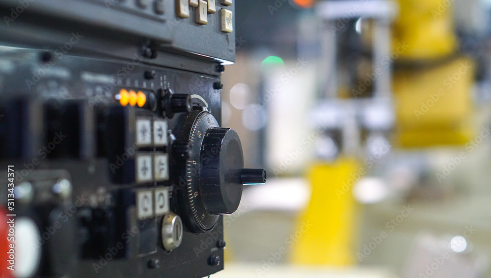 Blurred of factory robot arm with control box and copy space. Use for ...